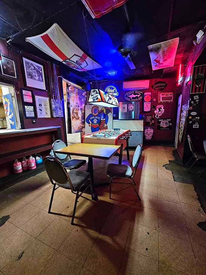 Blue neon and flags create an atmosphere that's part rec room, part time capsule, all character and charm.