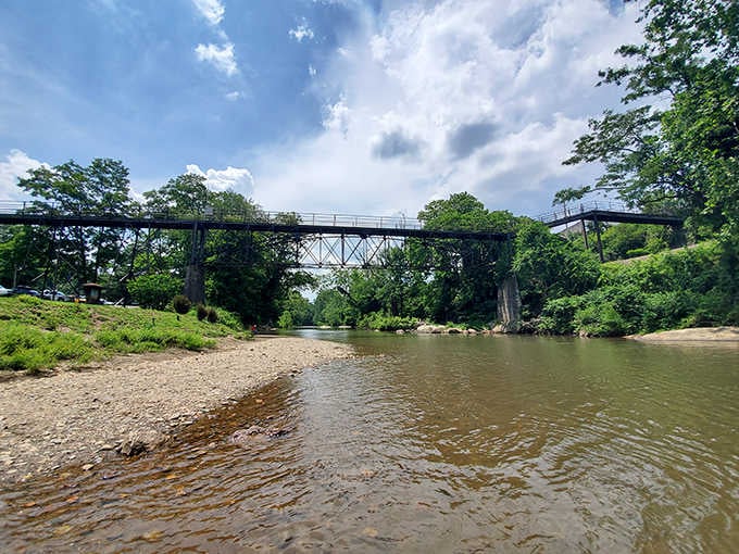 Riverside Park's iron bridge spans the North Toe River, connecting the town's past to its present while offering spectacular water views.