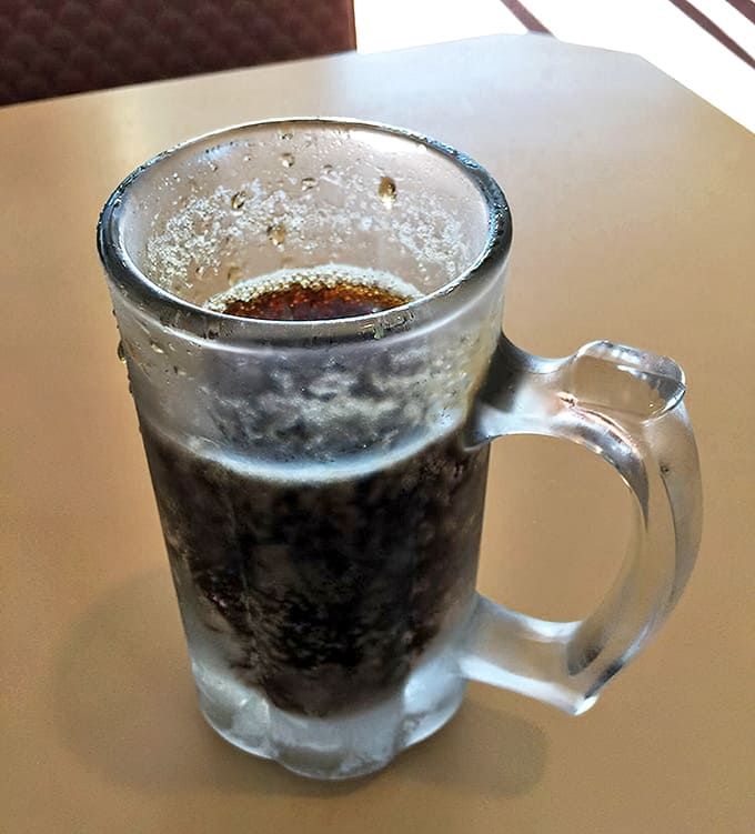 A frosty mug of root beer, condensation beading like morning dew. The perfect palate cleanser between bites of smoky goodness.