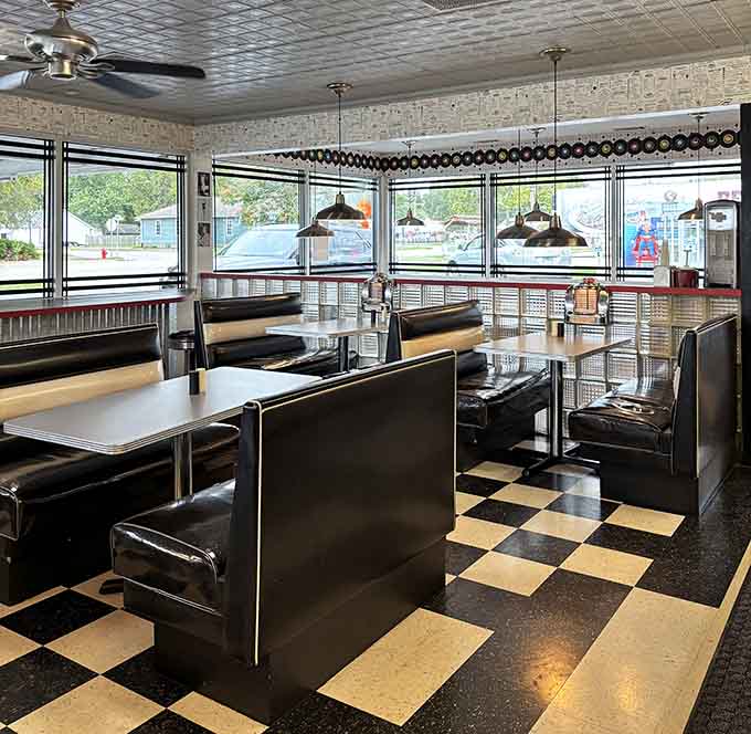 The tin ceiling and pendant lights create an atmosphere that Instagram filters can only dream of replicating naturally.