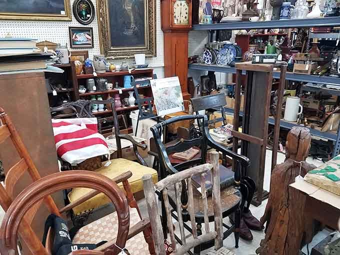 Mismatched chairs and tables wait patiently for someone to appreciate craftsmanship that actually meant something back then.
