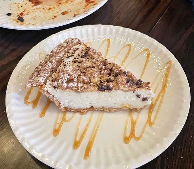 This cannoli cheesecake is what happens when Italian desserts have a delicious identity crisis and everyone wins.