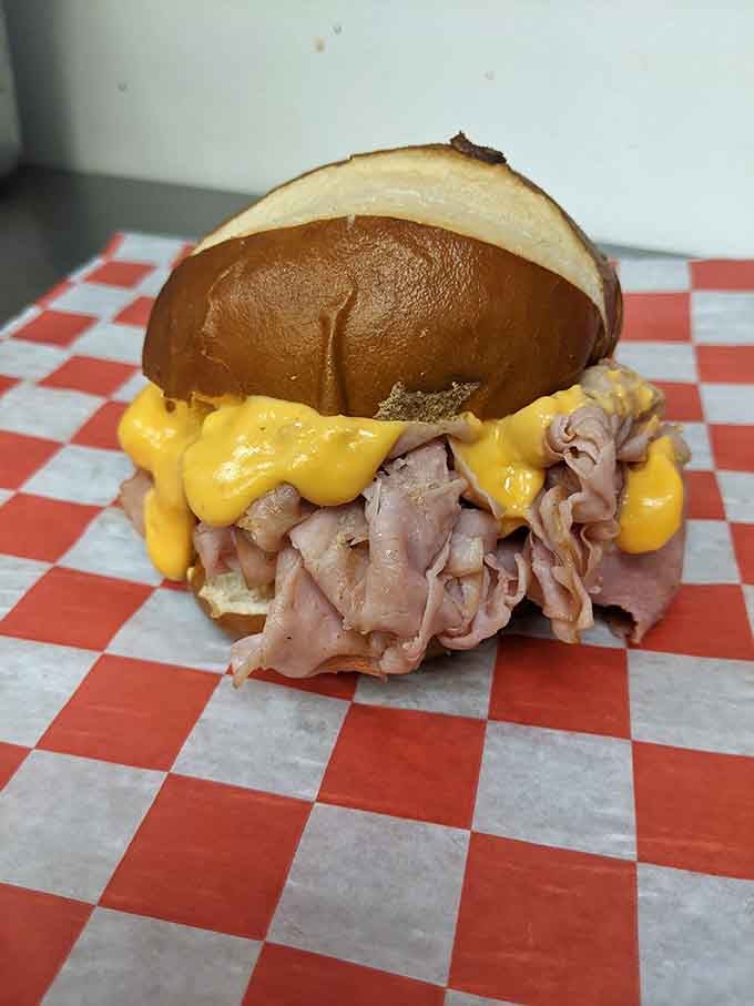 This sandwich isn't just food—it's architecture. The cheese cascading over thinly sliced meat creates the Frank Lloyd Wright of lunch options.