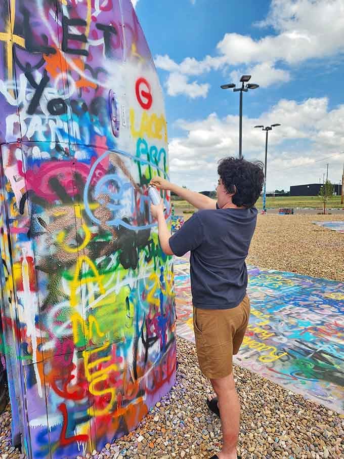 Young artists adding their mark to history, one spray paint stroke at a time, creating tomorrow's layers of memories.