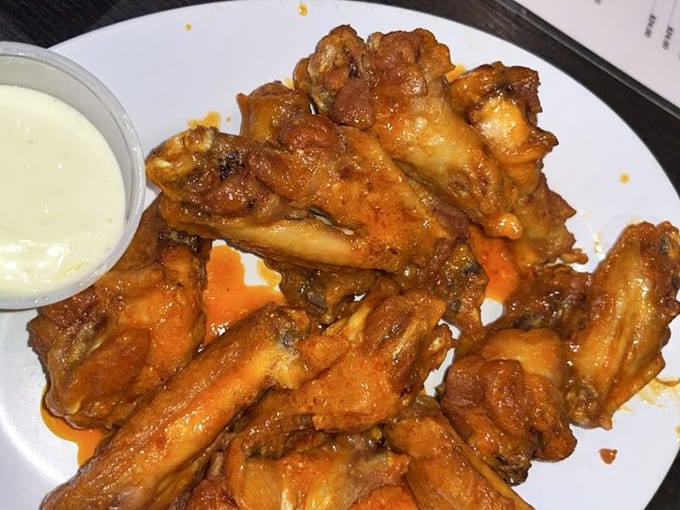 These wings arrive golden and glistening, ready to prove that Star Tavern's talents extend far beyond pizza perfection.