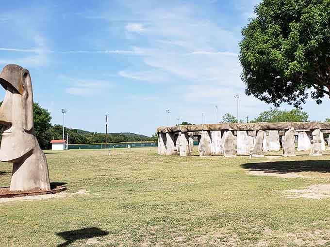 Two worlds collide as the moai surveys the stone circle, creating Instagram gold in rural Texas.