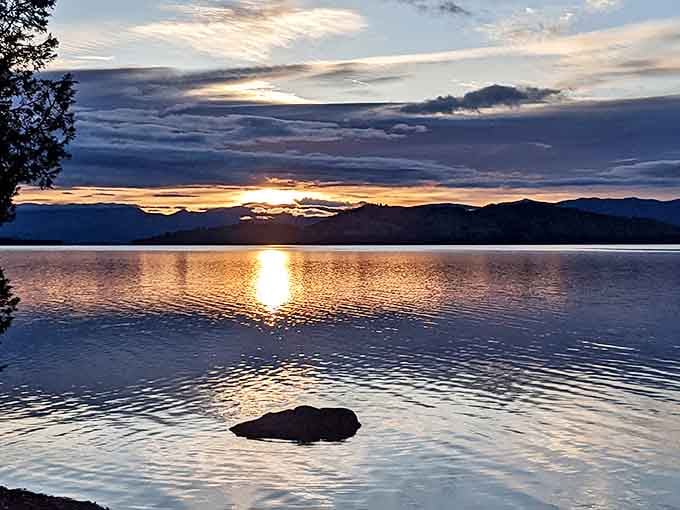 Nature's light show doesn't need special effects. Flathead Lake sunsets transform water into liquid gold while mountains stand in silent appreciation.