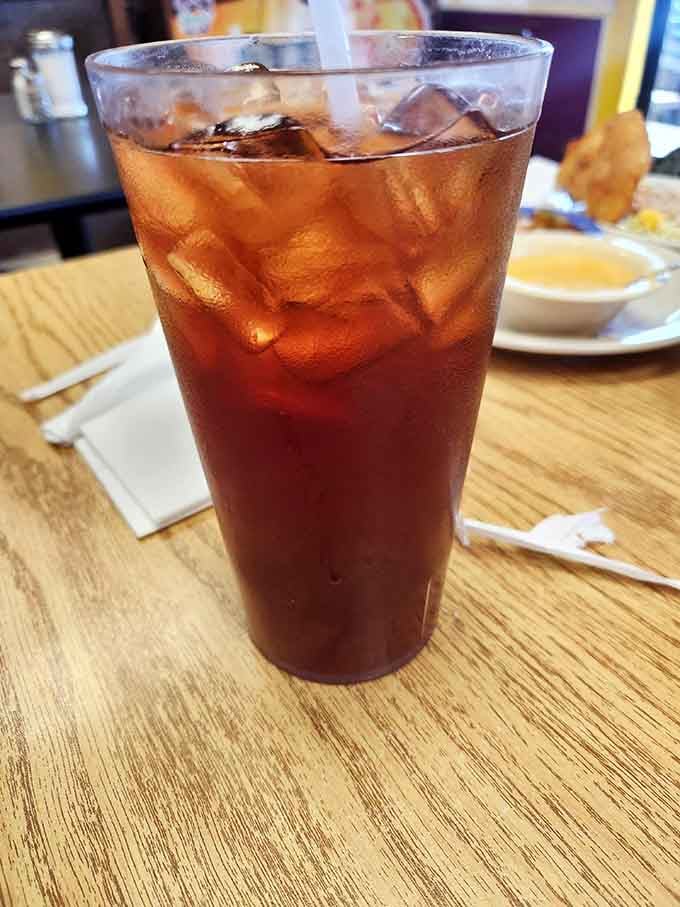 Sweet tea so perfectly amber it could be bottled and sold as liquid sunshine with ice cubes.