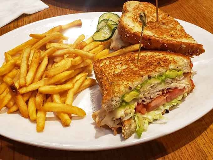 This avocado-topped sandwich situation looks like it walked straight out of a food magazine onto your plate.