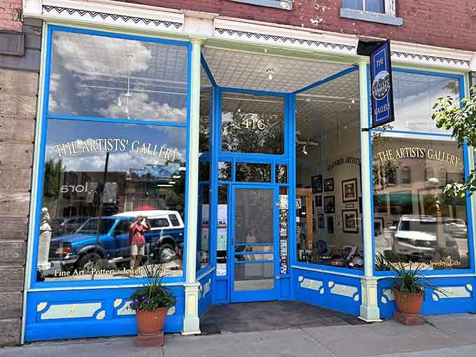 The Artists' Gallery's cheerful blue storefront invites you in like that friend who always has the most interesting stories to tell.