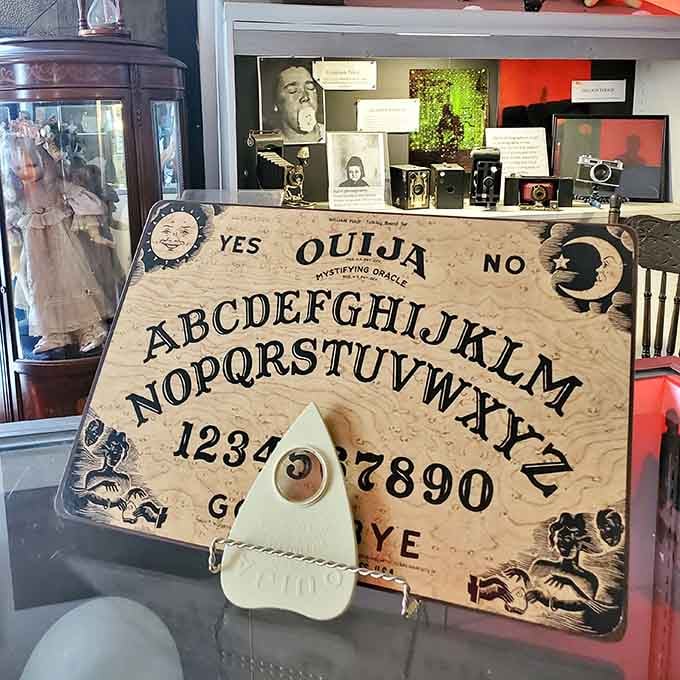 That oversized Ouija board isn't just decorative; it's a reminder of humanity's endless fascination with contacting the other side.