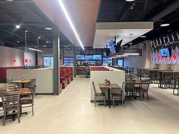 The G.O.A.T House offers modern sports bar comfort without pretension. Those empty tables won't stay that way once the game starts.