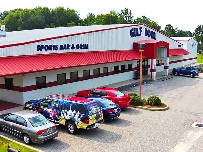 Gulf Bowl combines strikes and seafood in one red-roofed destination, proving that bowling shoes and butter sauce can happily coexist.