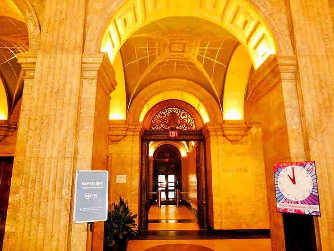 Golden archways frame your path to discovery, where warm lighting creates an atmosphere of anticipation and wonder.