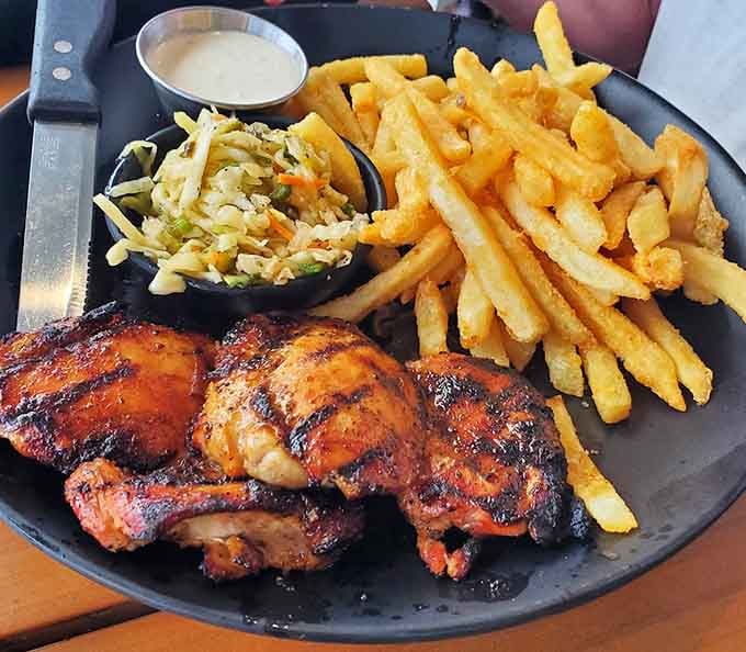 Grilled chicken thighs with a char that'll make you forget you came here for the seafood.