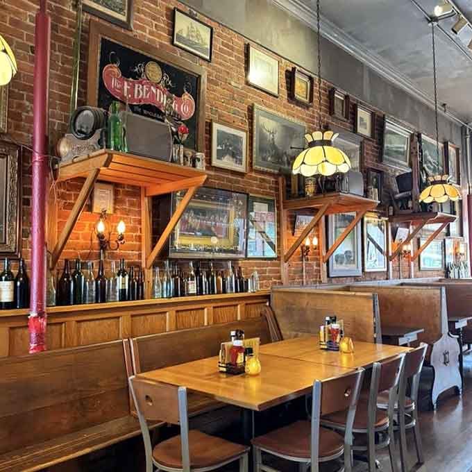 Exposed brick walls and vintage fixtures create an atmosphere that feels like dinner at your coolest uncle's place, if he happened to brew exceptional beer.
