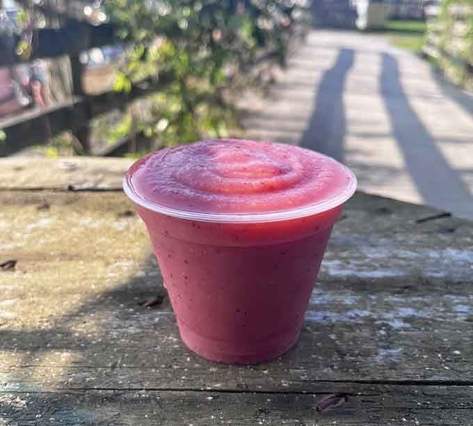 A frozen smoothie catching the light on the dock, because even seafood lovers need something refreshing between bites.