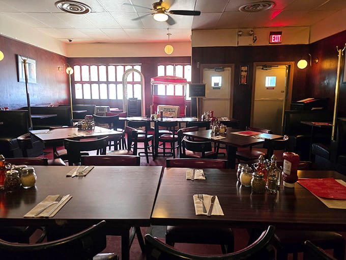 Dark wood booths and that rosy lighting create the perfect atmosphere for lingering over dinner.