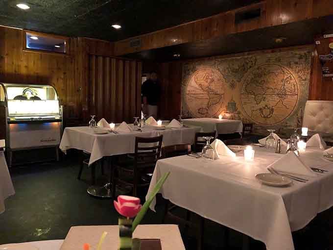 Vintage maps on the walls transport diners to another era when three-hour dinners were normal, not indulgent.