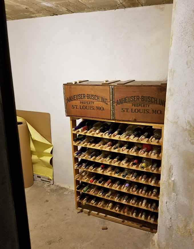 Vintage Anheuser-Busch crates now hold wine bottles, proving good storage solutions never go out of style completely.