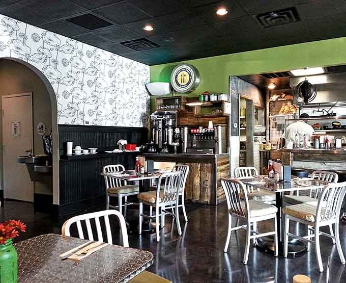 That pop of lime green against the floral wallpaper creates an atmosphere that's both hip and homey simultaneously.