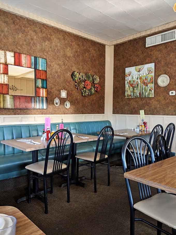 Wood paneling and colorful artwork create that cozy diner atmosphere where time slows down just enough to enjoy.