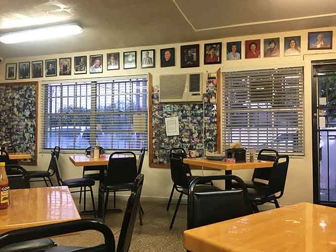 Another angle reveals more simple seating and walls covered in photos telling decades of delicious stories.
