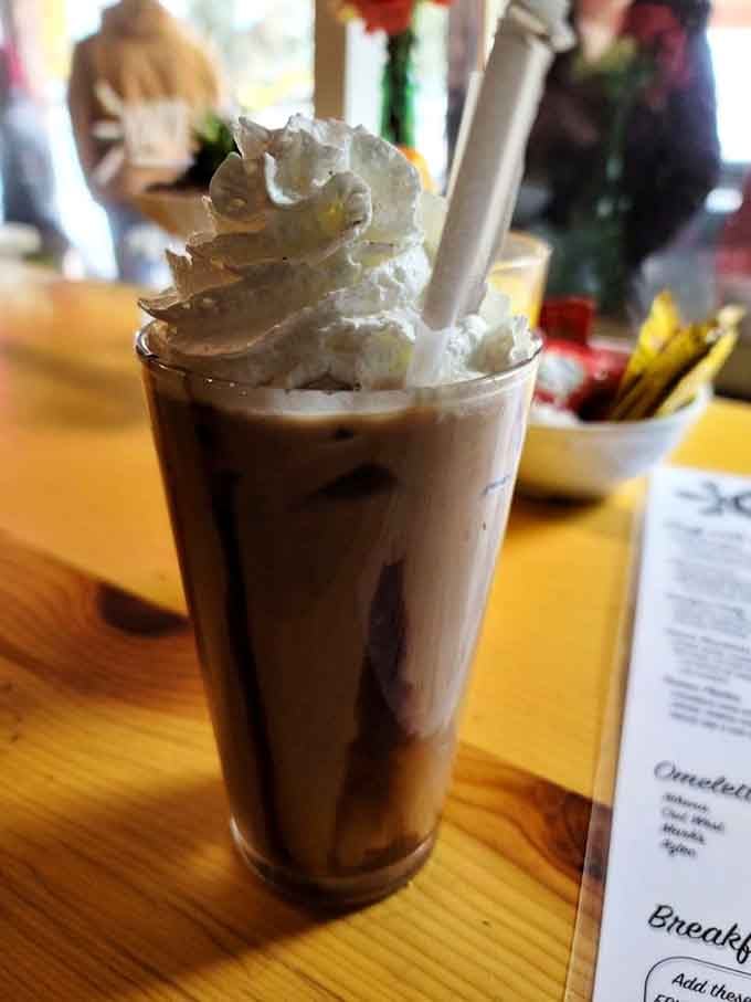 Iced mocha topped with whipped cream, because sometimes you need dessert with your breakfast and nobody's here to judge your choices.