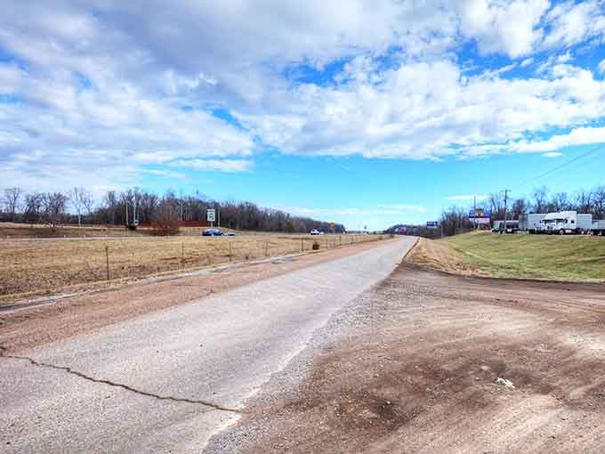 The road into Mooresville stretches toward possibility, framed by Alabama sky so vast it makes you feel simultaneously tiny and infinite.