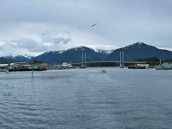 O'Connell Bridge connects Sitka's island life to the mainland, with snow-capped mountains creating a backdrop worthy of a thousand postcards.