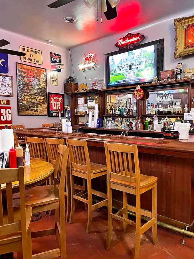 The bar area&mdash;where barbecue stories get better with each telling. Sports memorabilia and cold drinks create the perfect intermission between meat courses.