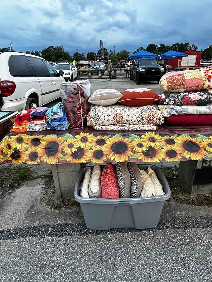 Sunflower-printed bedding and cozy pillows transform outdoor shopping into a home goods paradise, proving comfort doesn't require department store prices.