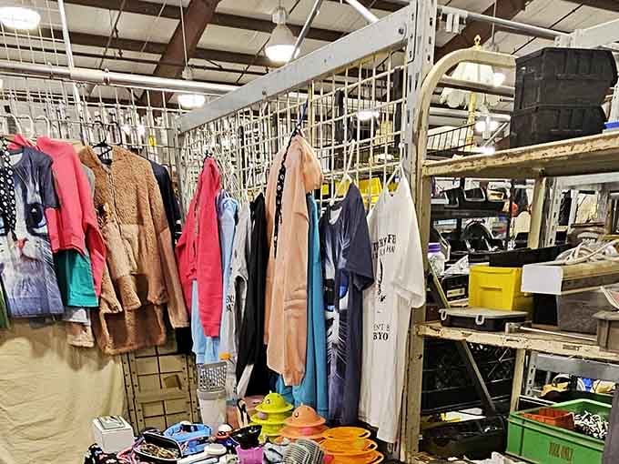 Vintage clothing hangs like colorful flags, each piece a time capsule from decades when fashion made bolder statements.