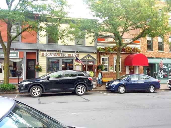 The heart of downtown Skaneateles invites leisurely strolls, with Doug's Fish Fry's cheerful awning promising the kind of seafood that makes you forget you're hours from any ocean.