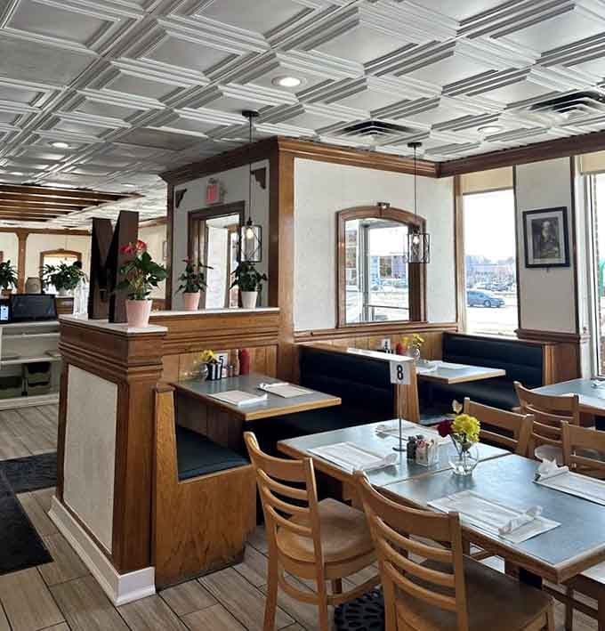 Cozy booths and warm wood tones create the perfect backdrop for conversations that linger longer than your coffee needs refilling.