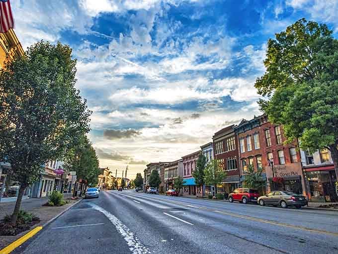 Sunset casts a golden glow on Madison's Main Street, transforming ordinary brick buildings into a painter's dream of small-town America.