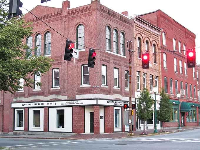 Corner buildings anchor Gardiner's downtown with architectural authority, their brick facades telling stories of commerce through the ages.