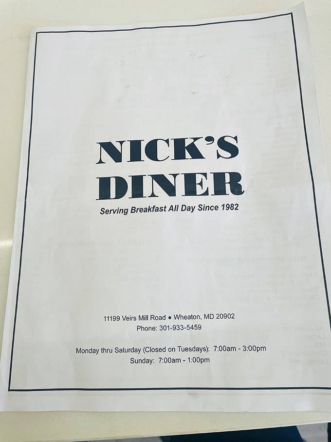 The menu cover tells you everything you need to know: breakfast all day since 1982, because some traditions deserve preservation.