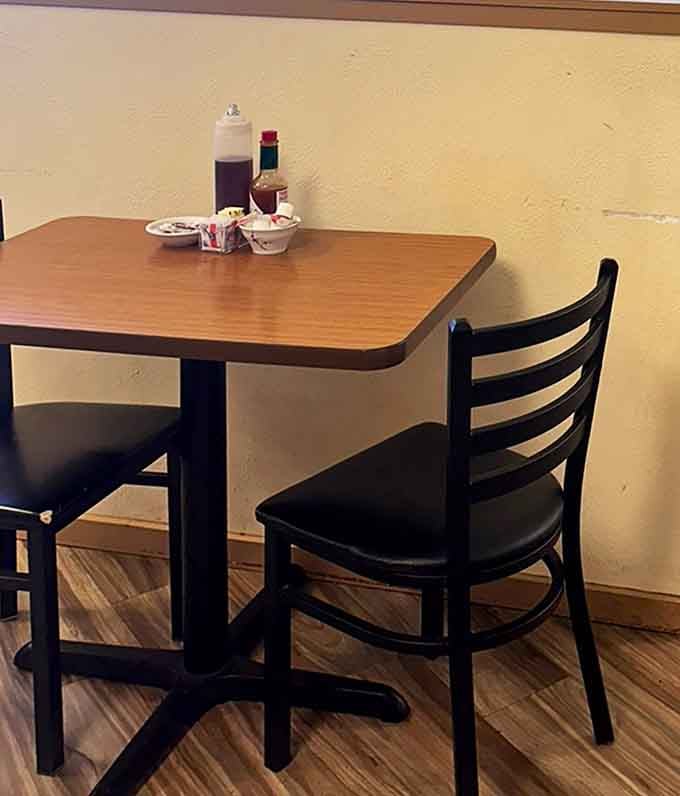 The humble table setting stands ready for action &ndash; condiments at attention like loyal soldiers preparing for the imminent arrival of breakfast battalions.