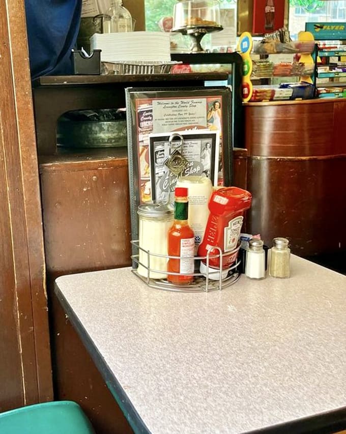 Table condiments arranged with the care of museum artifacts&mdash;these bottles have witnessed more meaningful conversations than most therapists.