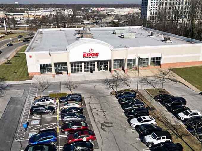 That fitness center sits ready for action, proving suburban life means convenience with plenty of parking for everyone.