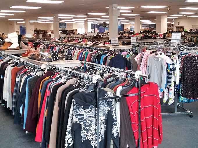 A rainbow of clothing fills circular racks in this vast space where every color tells a different style story.