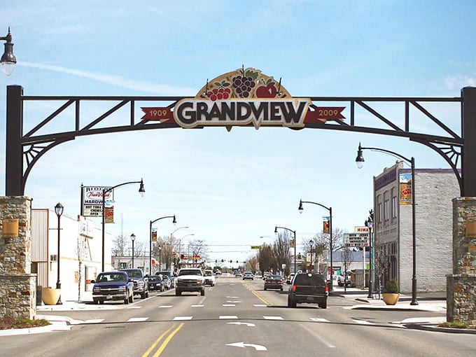 The Grandview arch welcomes visitors with grape clusters celebrating the agricultural heritage that built this valley community.