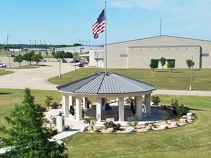 A peaceful pavilion stands beneath Old Glory, offering shade and a perfect spot for contemplating your excellent life choices.