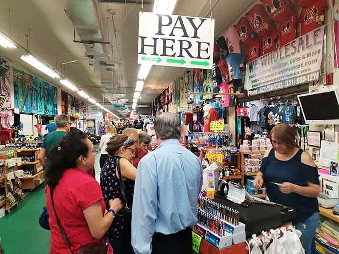 The bustling indoor corridor hums with energy as shoppers navigate aisles packed tighter than a holiday mall.