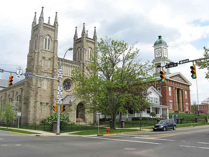 Twin church spires reach skyward beside the courthouse, anchoring a downtown where tradition and affordability walk hand in hand.