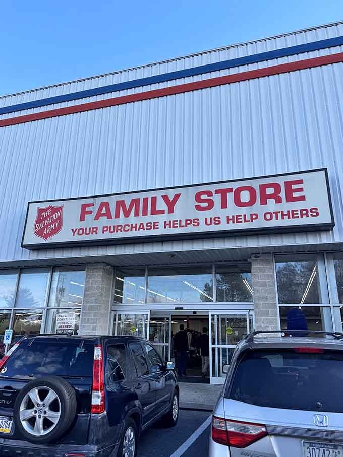 The patriotic stripes across that metal building announce a place where your shopping dollars directly help neighbors facing hard times.