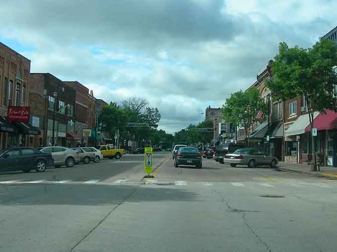 Red brick buildings march down the street in perfect formation, each one holding decades of small-town memories inside.