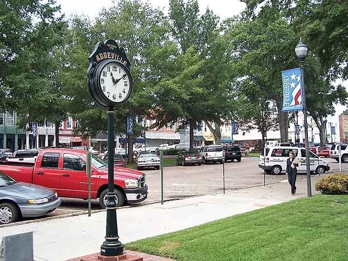 The town clock keeps time in a place where rushing is optional and sitting on a bench counts.