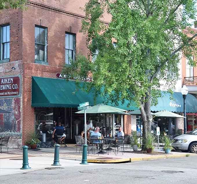 Outdoor seating under leafy trees invites you to sit, sip, and savor the good life on a modest budget.